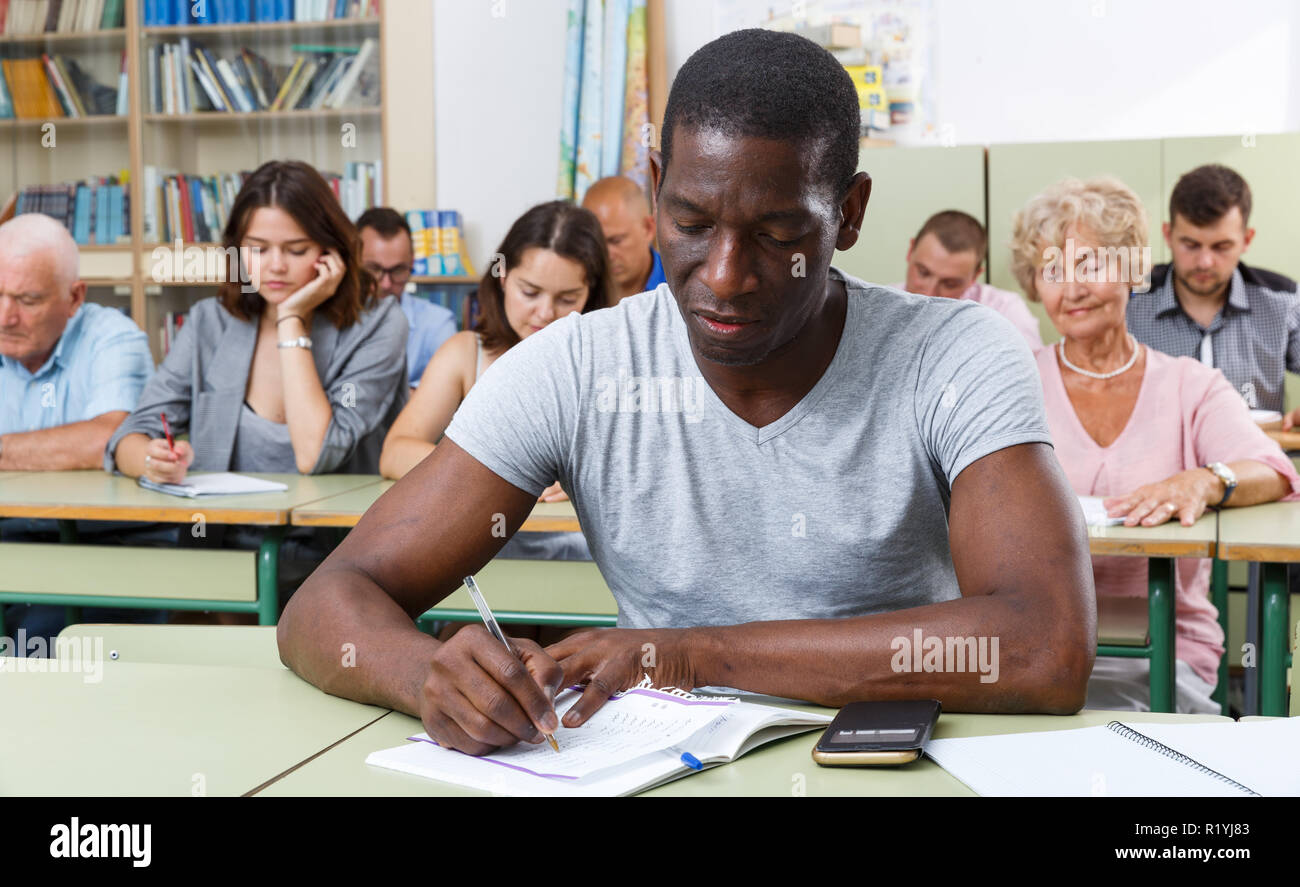 African American man take a written exam in the classroom Stock Photo ...