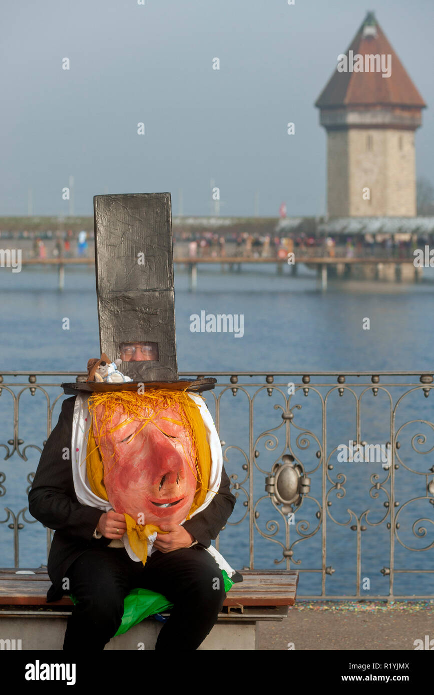 man with a very big head wearing a huge hat at Luzern Carnival ...