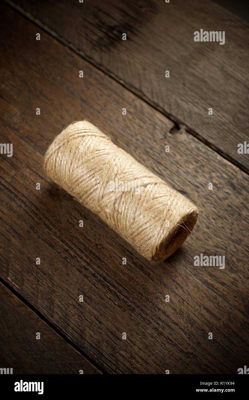 Natural rope on a wood table Stock Photo - Alamy