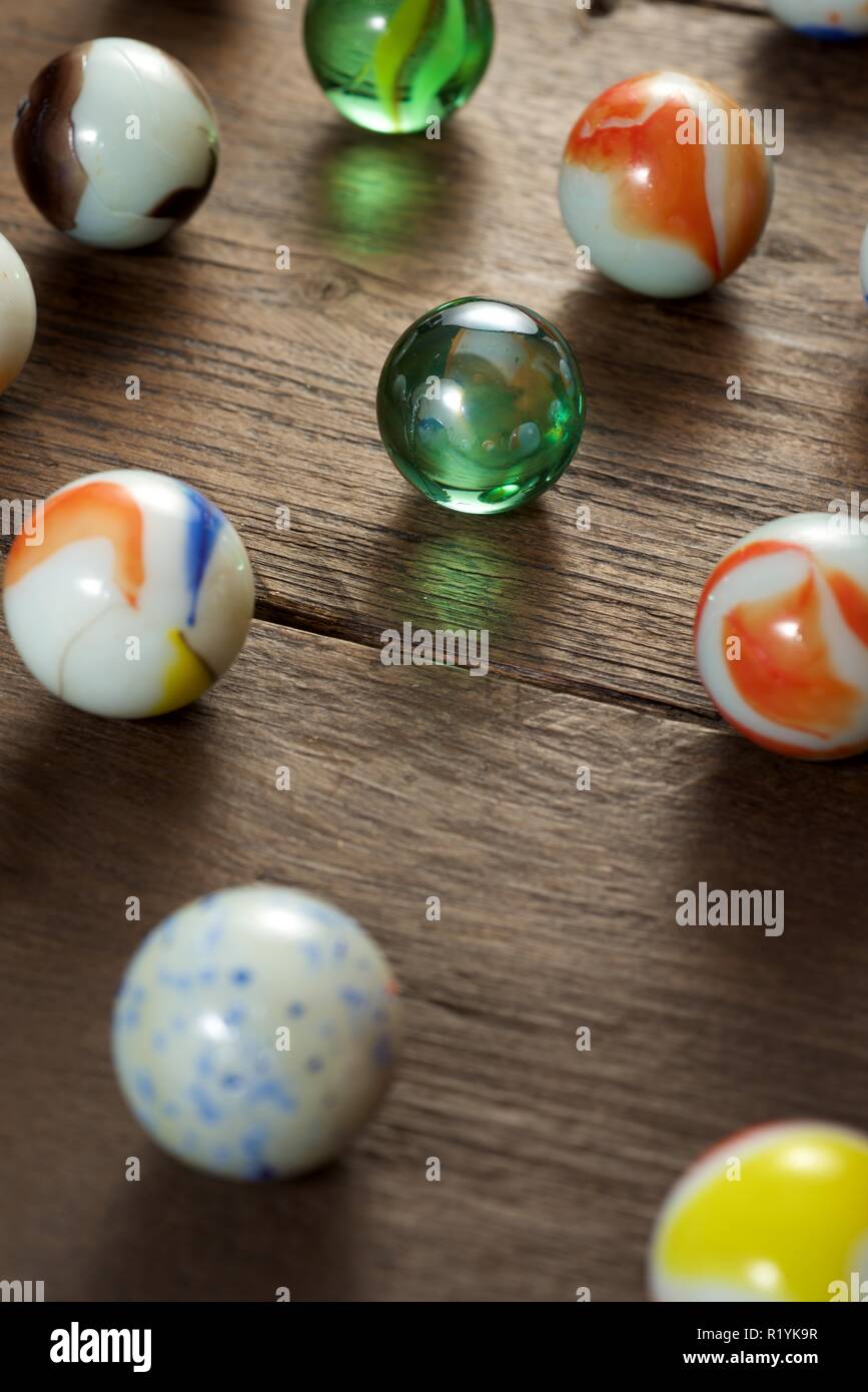 Glass balls on a wood table Stock Photo - Alamy