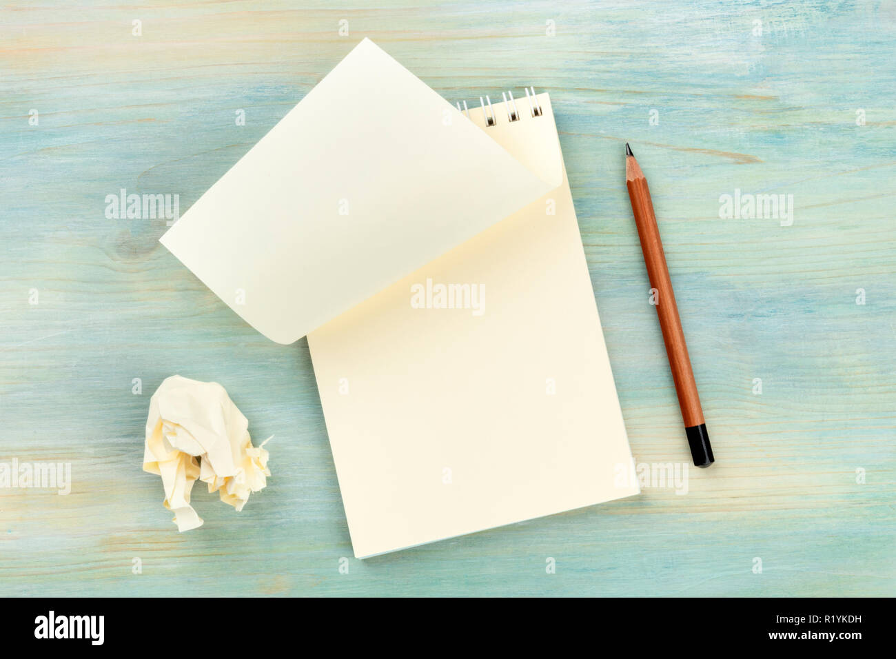Turn a New Page. An overhead photo of a spiral notepad with a blank ...