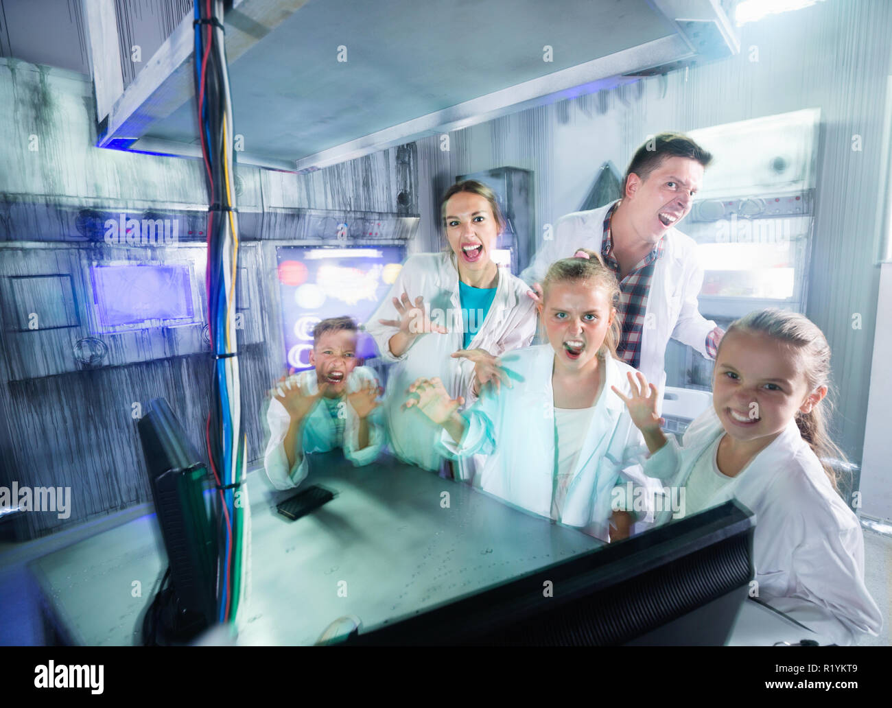 Happy cheerful family of five is depisting madness in time having fun ...