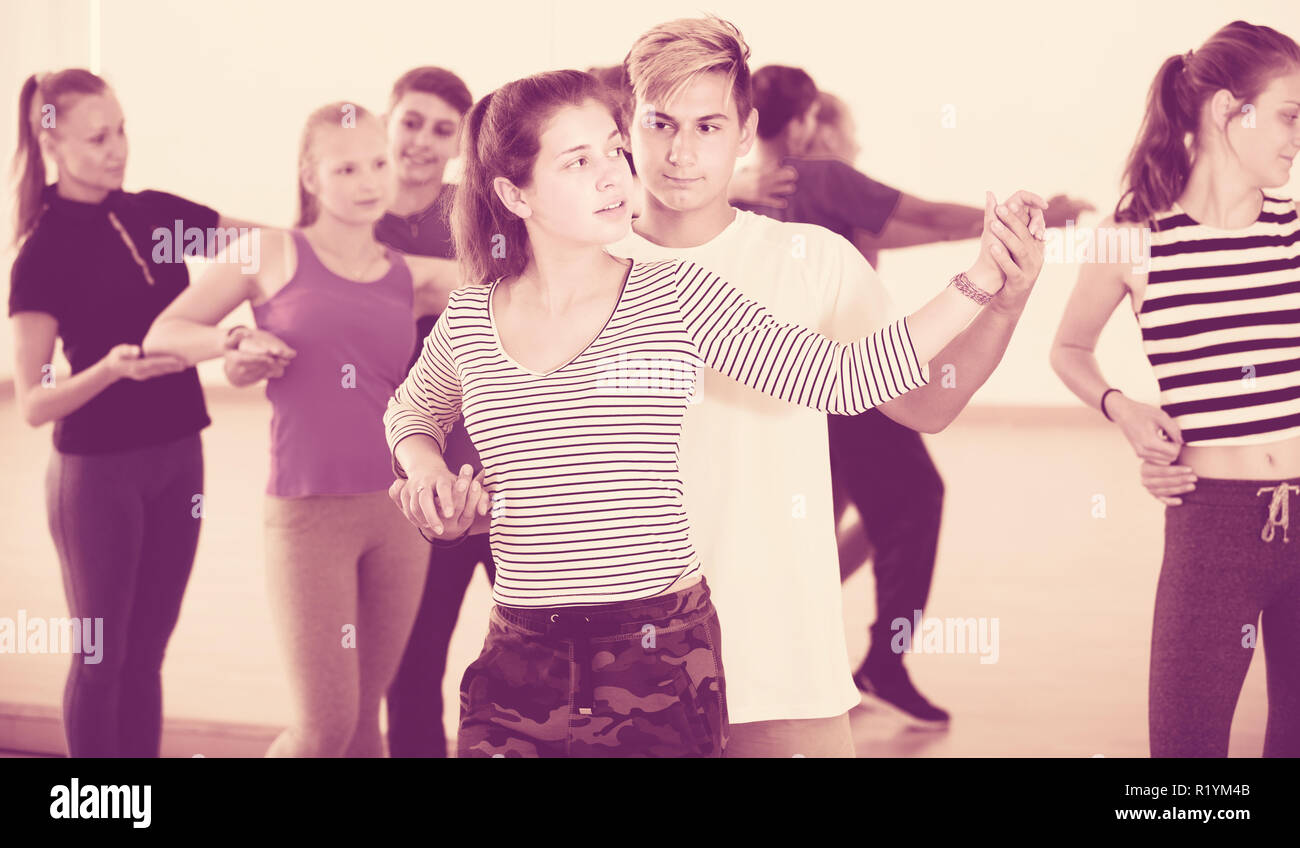 Portrait of young couples dancing of partner dance at dance school ...