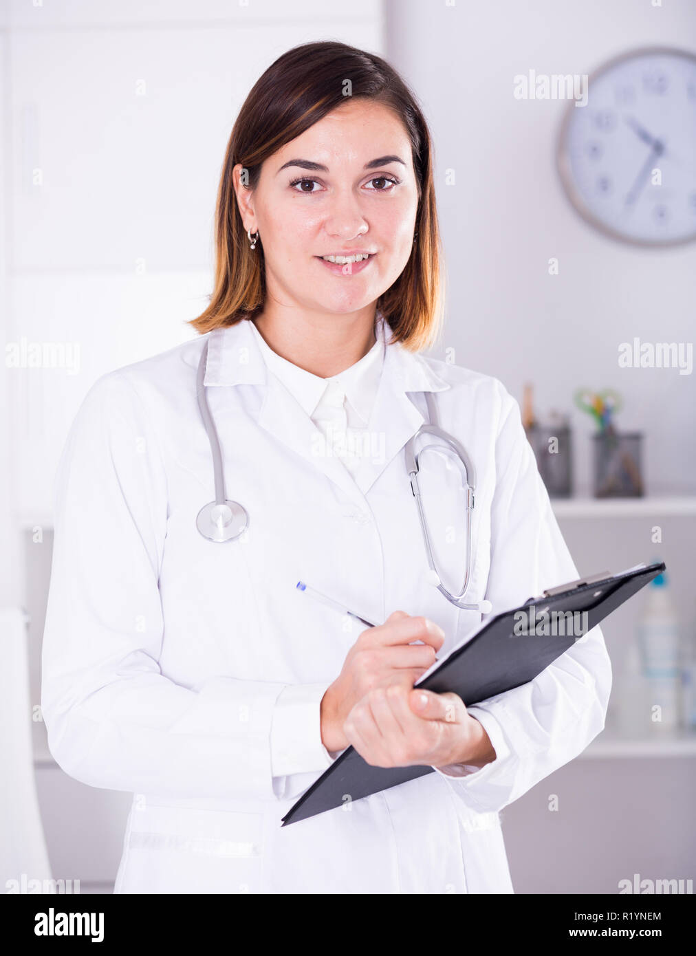 Young female doctor ready to receive clients in her office Stock Photo ...