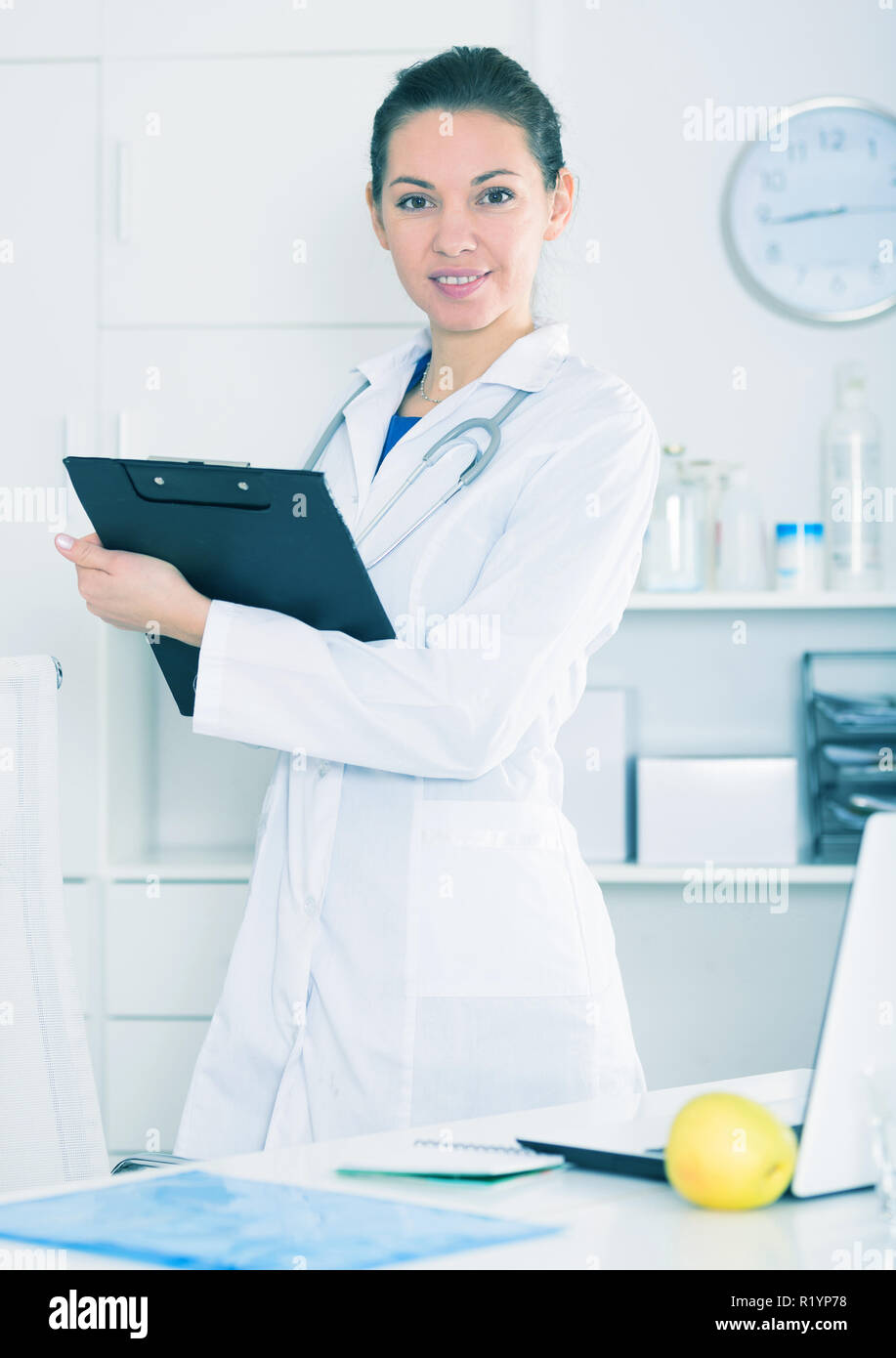 Young female doctor ready to receive clients in her office Stock Photo ...