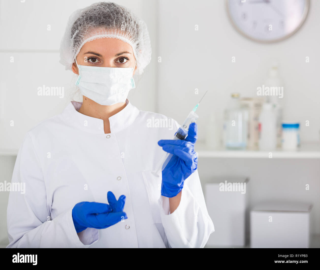 Professional nurse woman making injection in hospital Stock Photo - Alamy