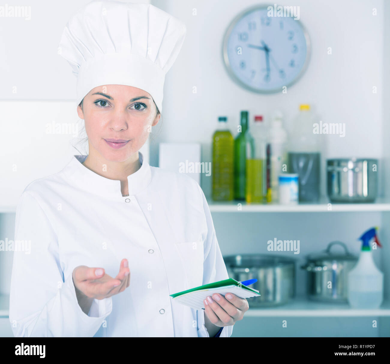 Young female cook preparing delicious food in kitchen Stock Photo - Alamy