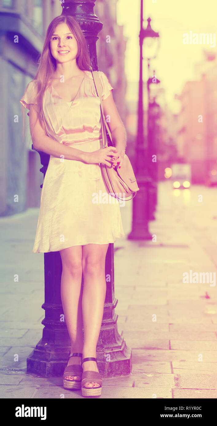 Young smiling belgian woman walking in historic city center Stock Photo ...