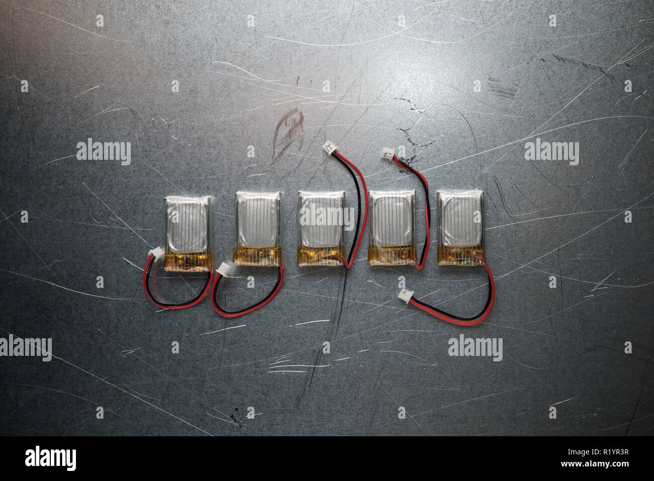 Drone batteries on a metal table Stock Photo - Alamy