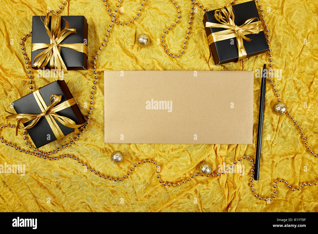 Pile of handmade luxury black gift boxes with gold ribbon DIY ...