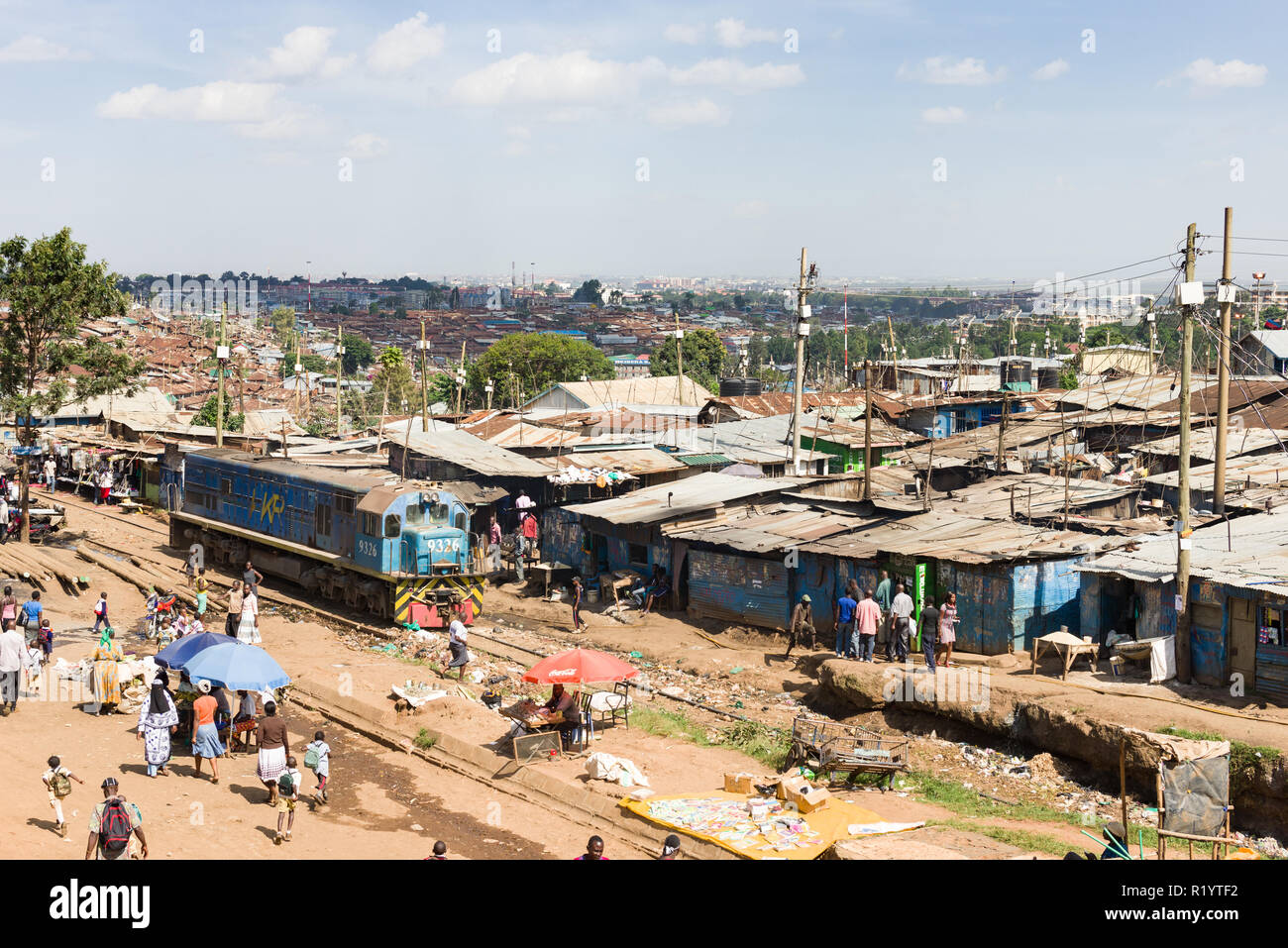 Kibera slum showing makeshift shack housing, men, women and children ...