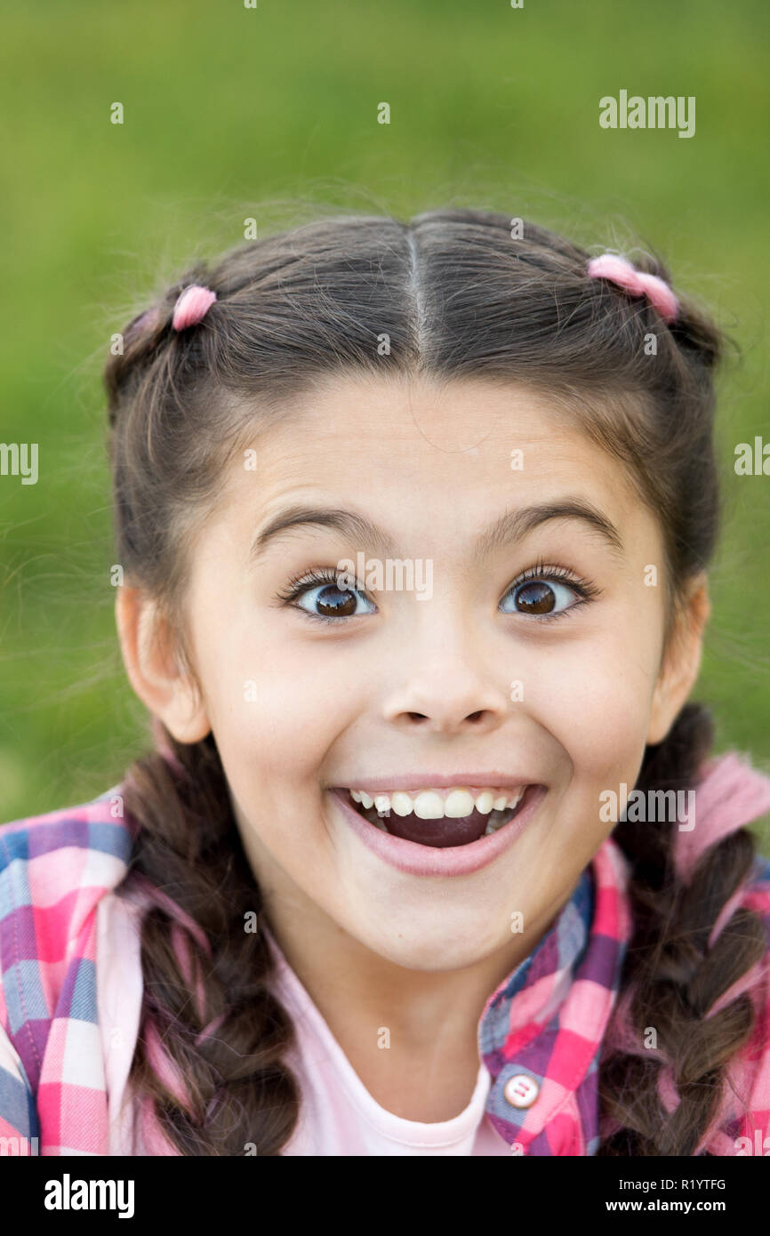 Cute surprised girl with smile on her face. Expression of happiness ...