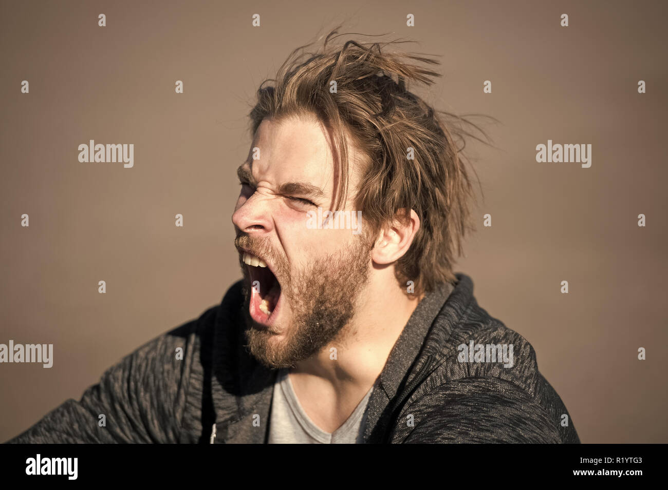 shouting or yawning handsome man or bearded guy with beard and stylish ...