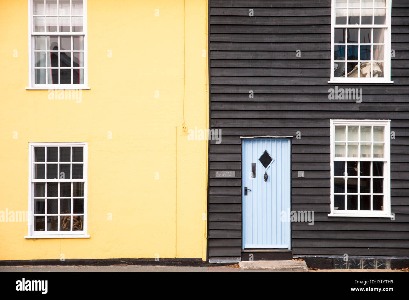 Traditional colourful homes with clapboard timber and sash windows in ...