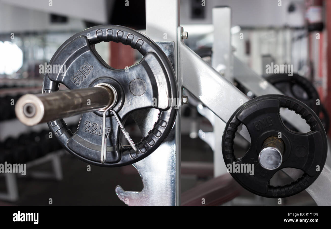 Closeup of weightlifting gear in modern gym interior Stock Photo - Alamy