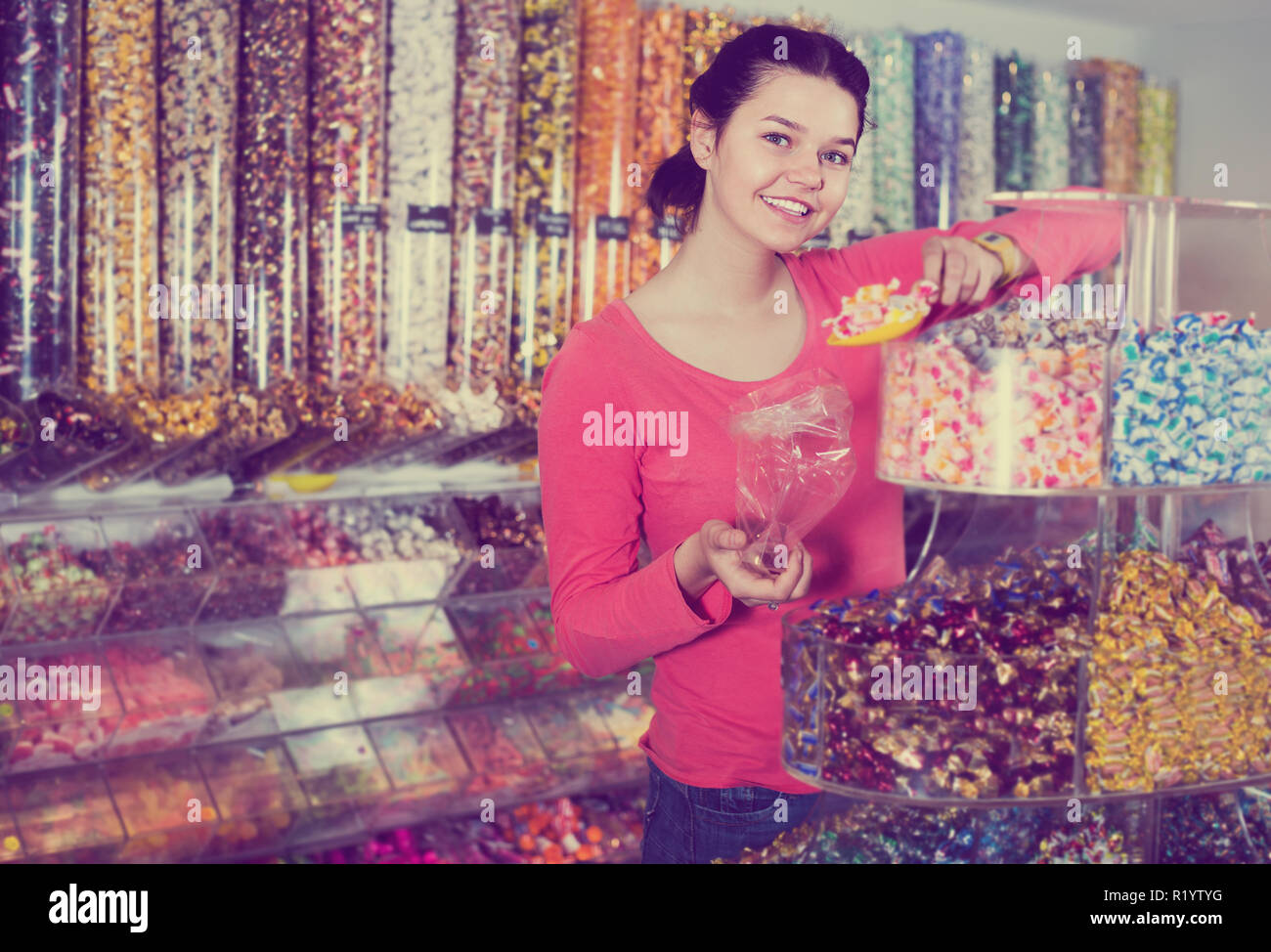 Woman buying candy bar hi-res stock photography and images - Alamy