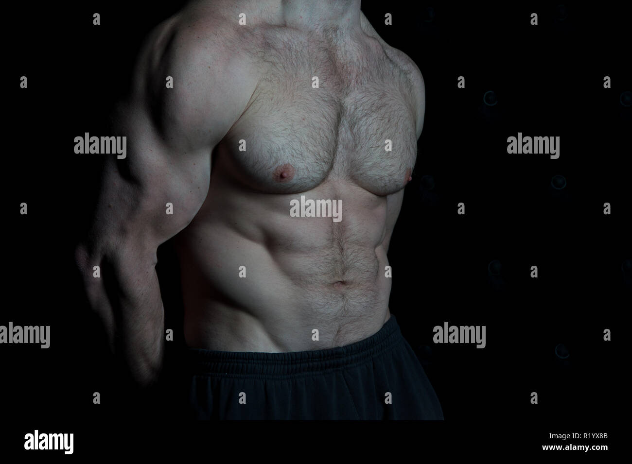 Serious about staying in shape. Torso with six packs looks attractive ...