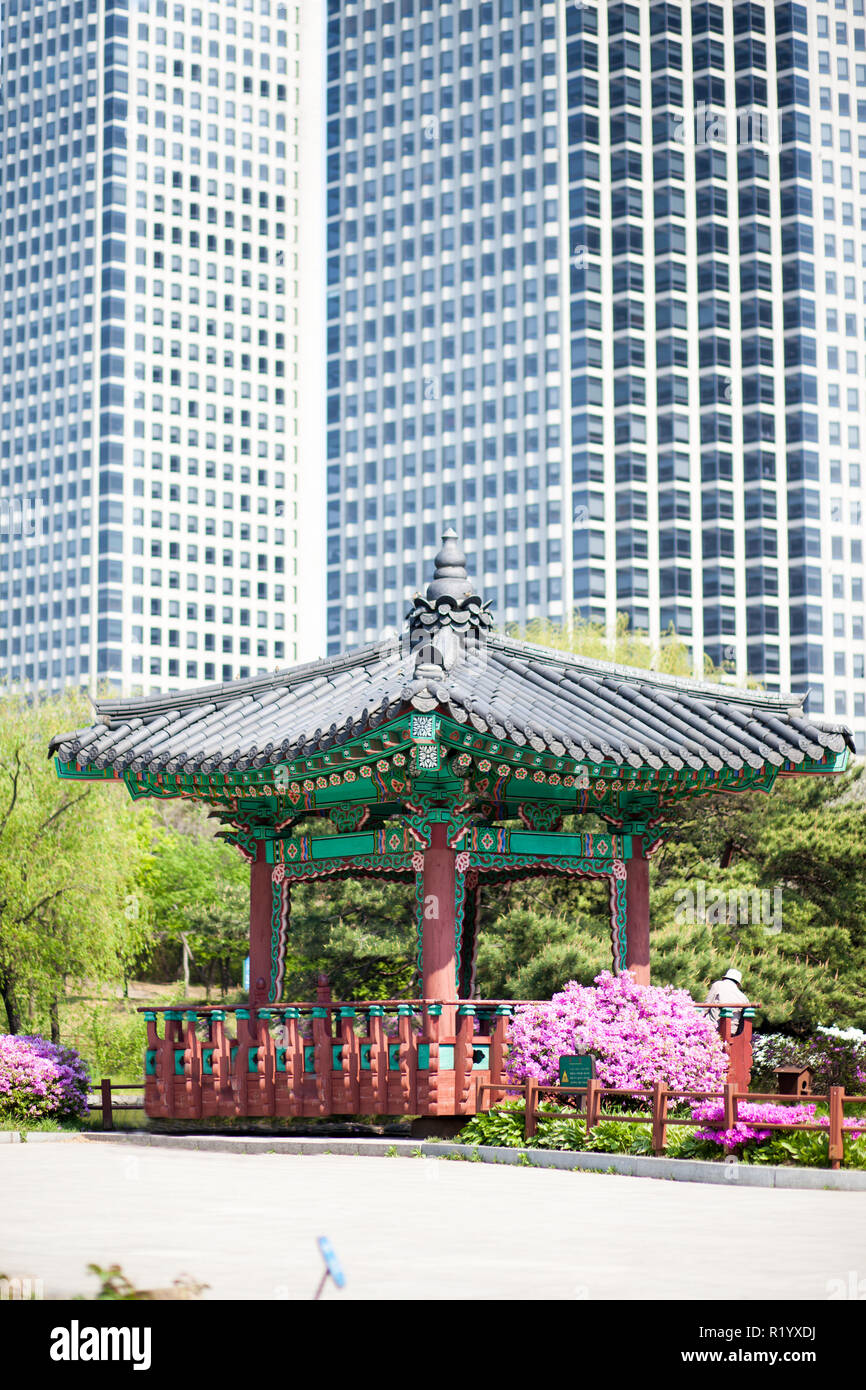 Traditional korean house against the background of modern buildings in ...