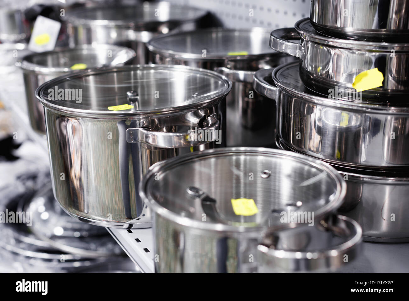 Image of stylish diverse shelfs with dishes in the kitchen department ...