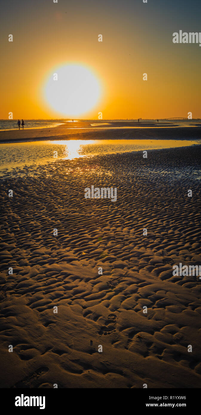 Bunche Beach Preserveat sunset with 2 people Stock Photo - Alamy