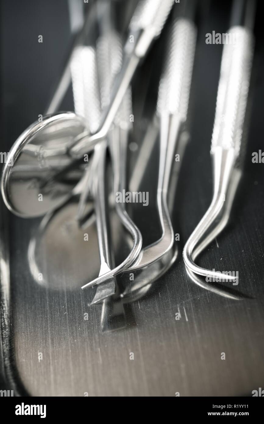 Instruments used by the dentist on a metal tray Stock Photo - Alamy