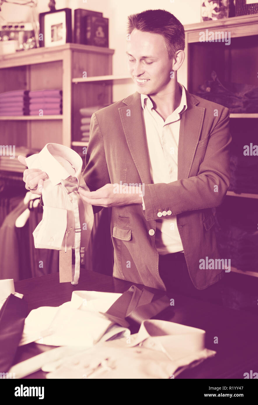 Male shopper buying new shirts hi-res stock photography and images - Alamy