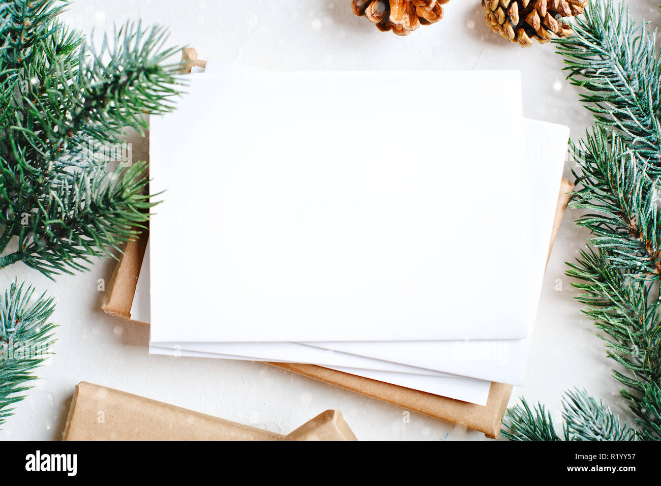 Merry Christmas and happy New year. Mockup with postcard and branches ...