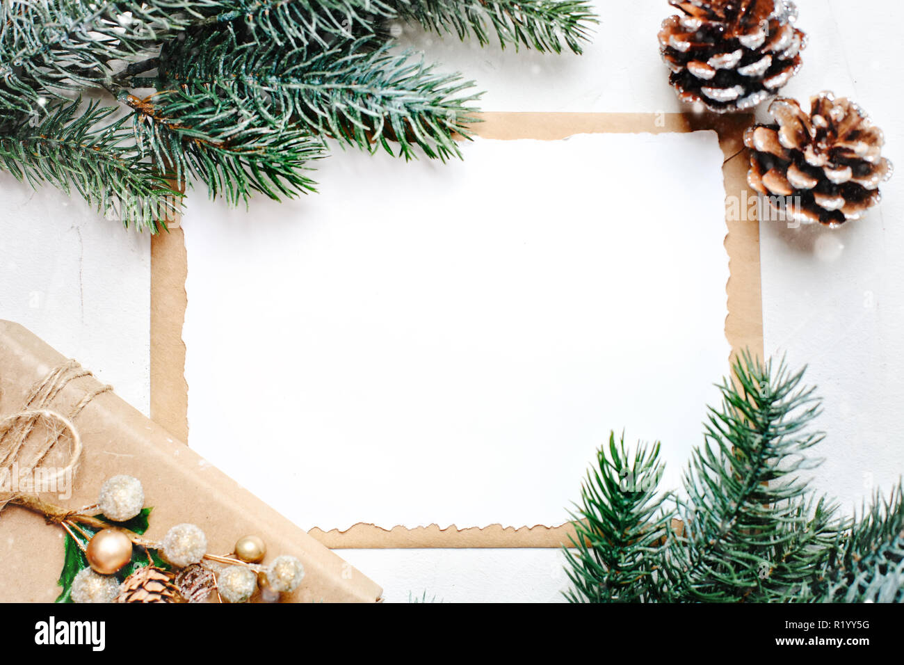 Merry Christmas and happy New year. Mockup with postcard and branches ...