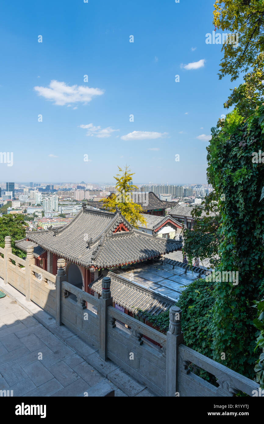 view of Jinan, China overlooking temple rooftops from 1000 Buddha ...