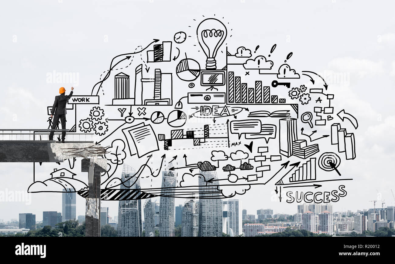 Businessman drawing business conceptual sketches Stock Photo - Alamy