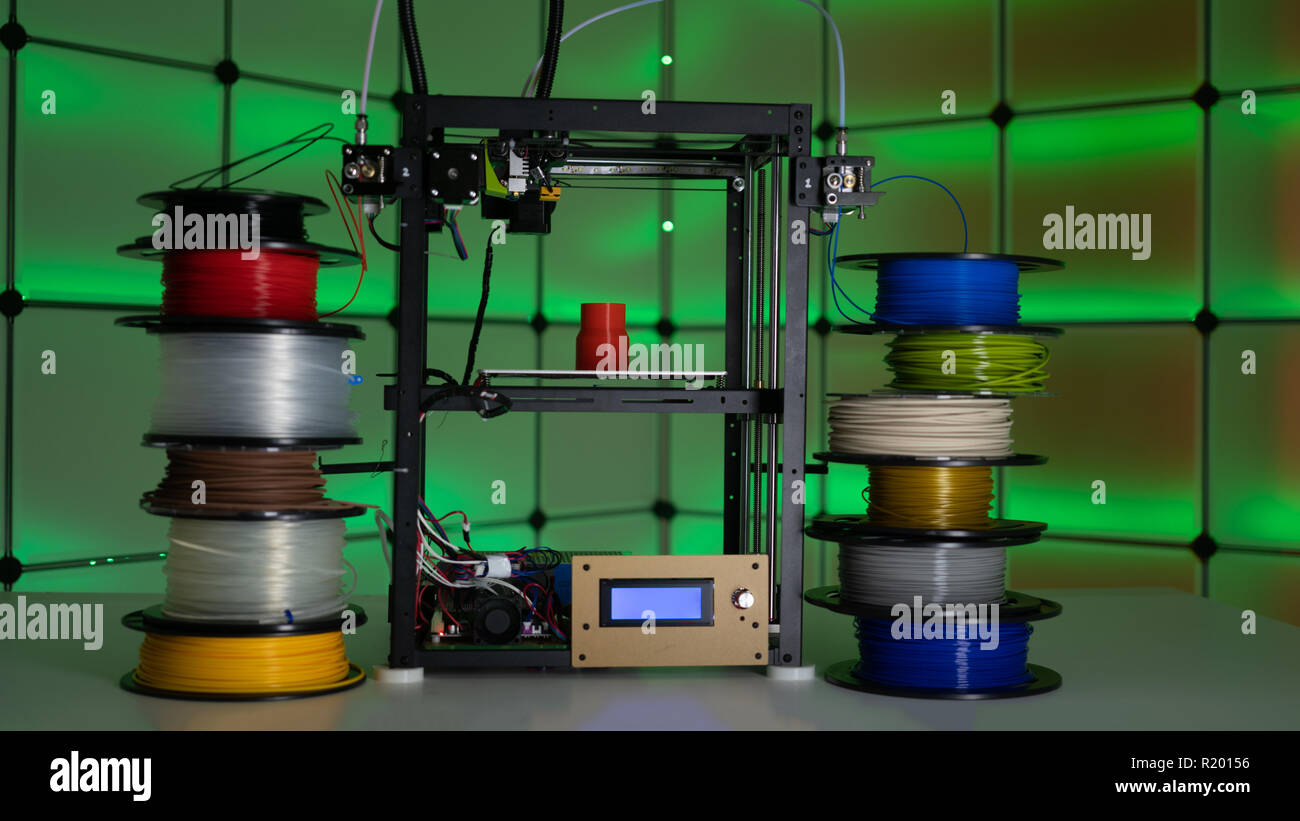 3d printer and plastic filament on color background Stock Photo - Alamy