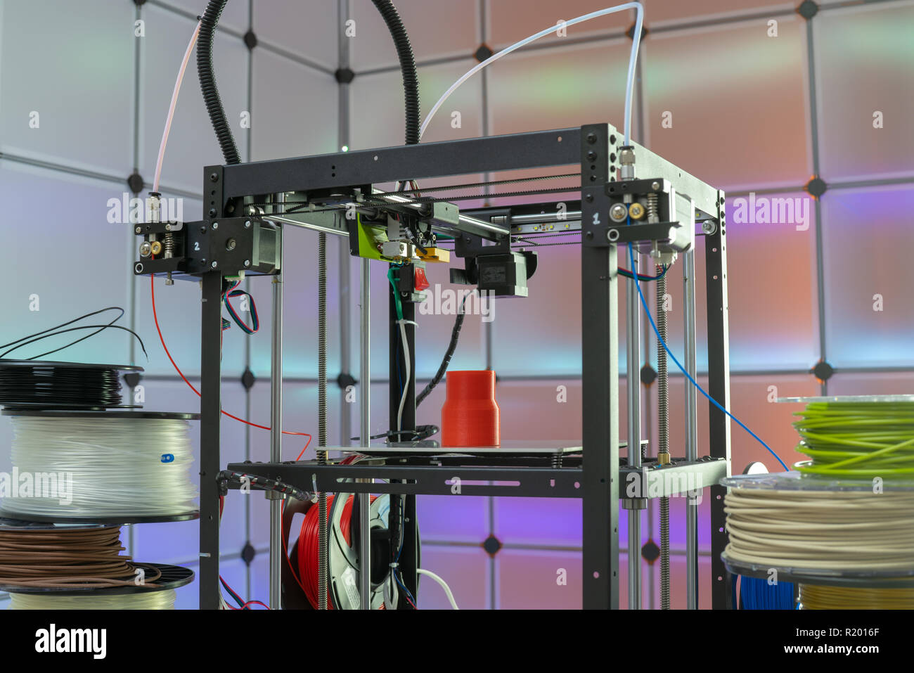 3d printer and plastic filament on color background Stock Photo - Alamy