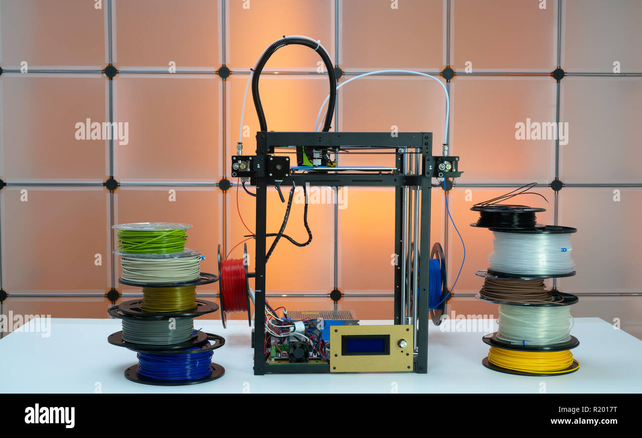 3d printer and plastic filament on color background Stock Photo - Alamy