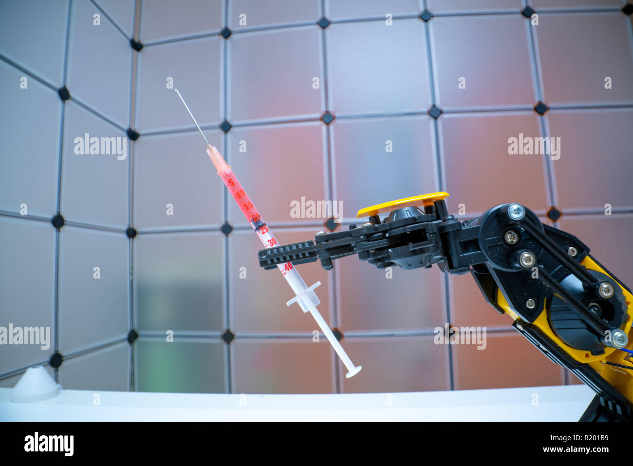 robot arm with medical syringe Stock Photo - Alamy