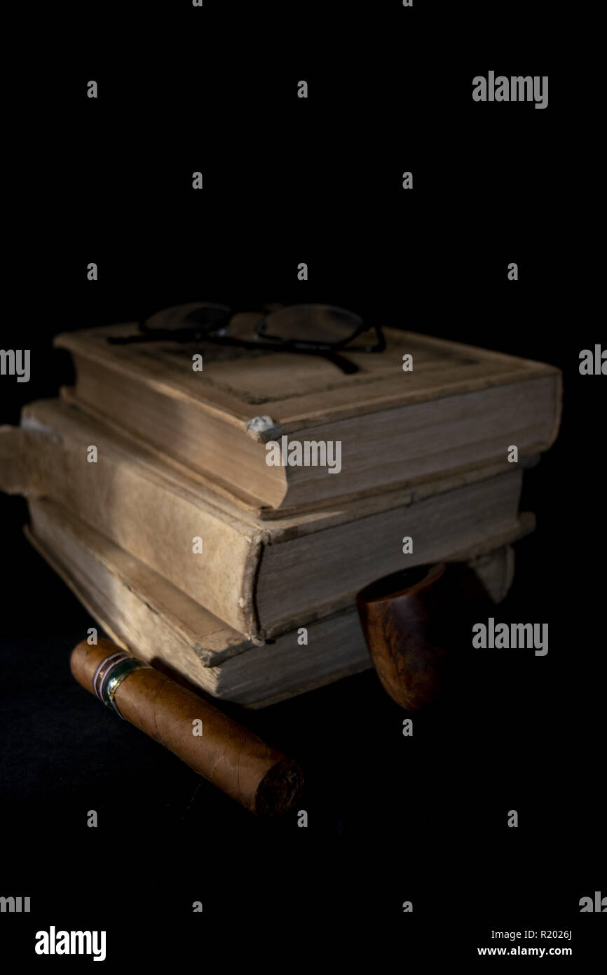 cuban cigar with metallic lighter on an old book Stock Photo - Alamy