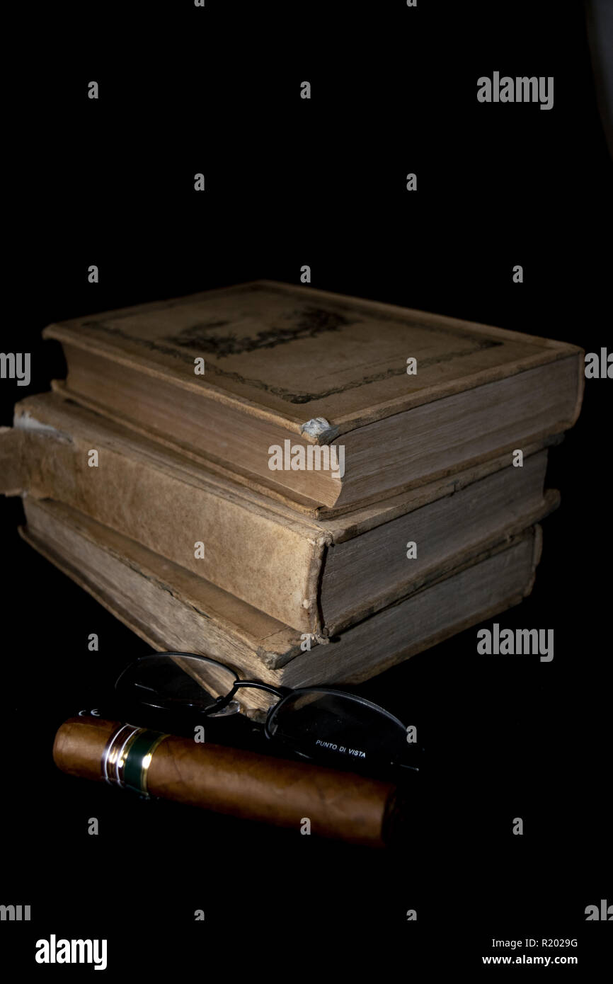 cuban cigar with metallic lighter on an old book Stock Photo - Alamy