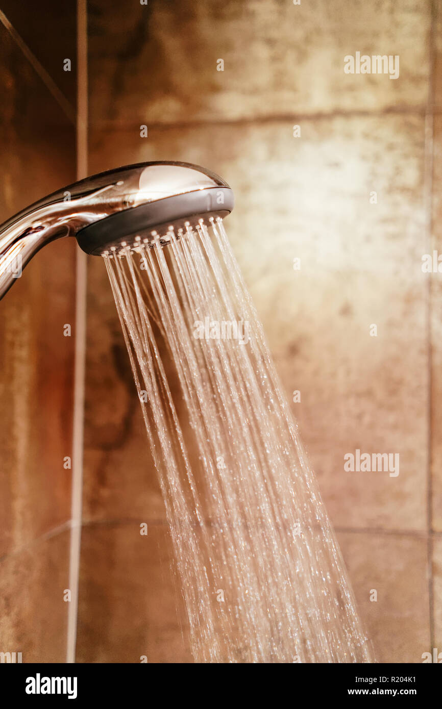 Shower head and the running water in a bath Stock Photo - Alamy