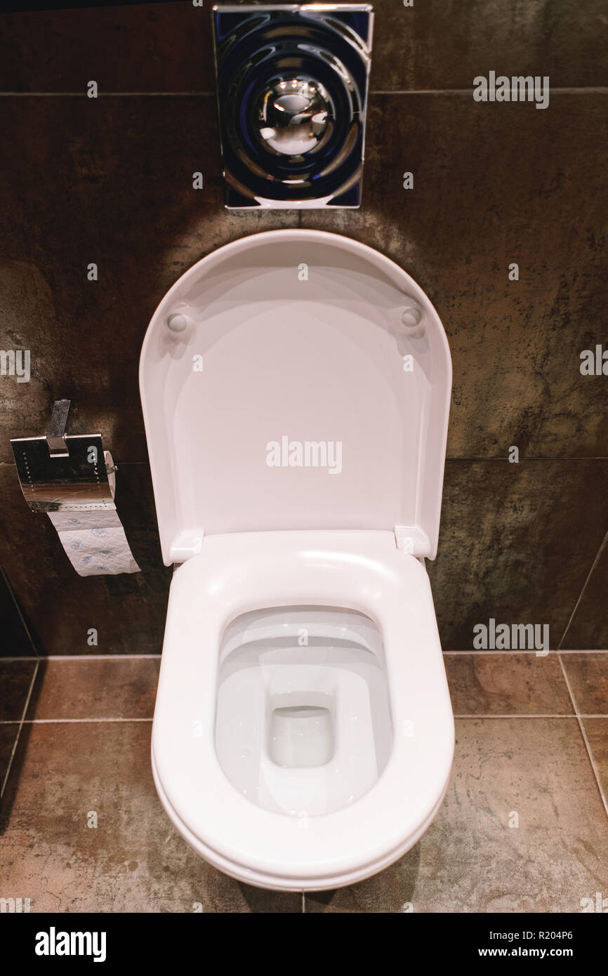 Open ceramic toilet bowl at the bathroom Stock Photo - Alamy