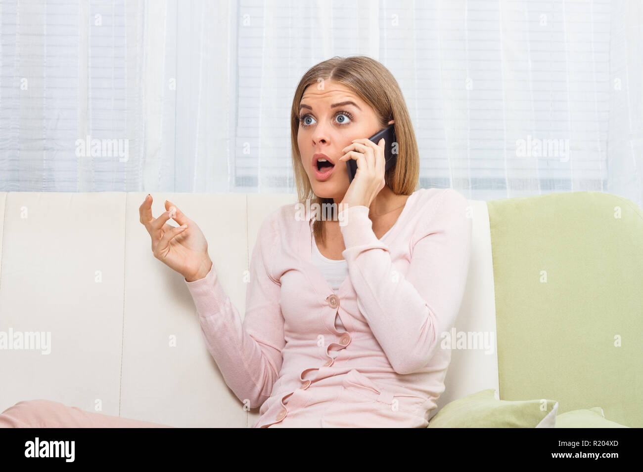 Woman on the phone worried blond hi-res stock photography and images ...