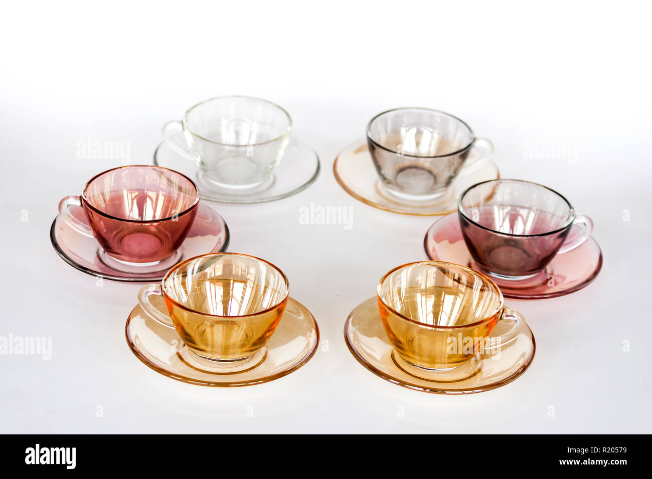 Set of coloured glass tea - coffee cups on white background ...