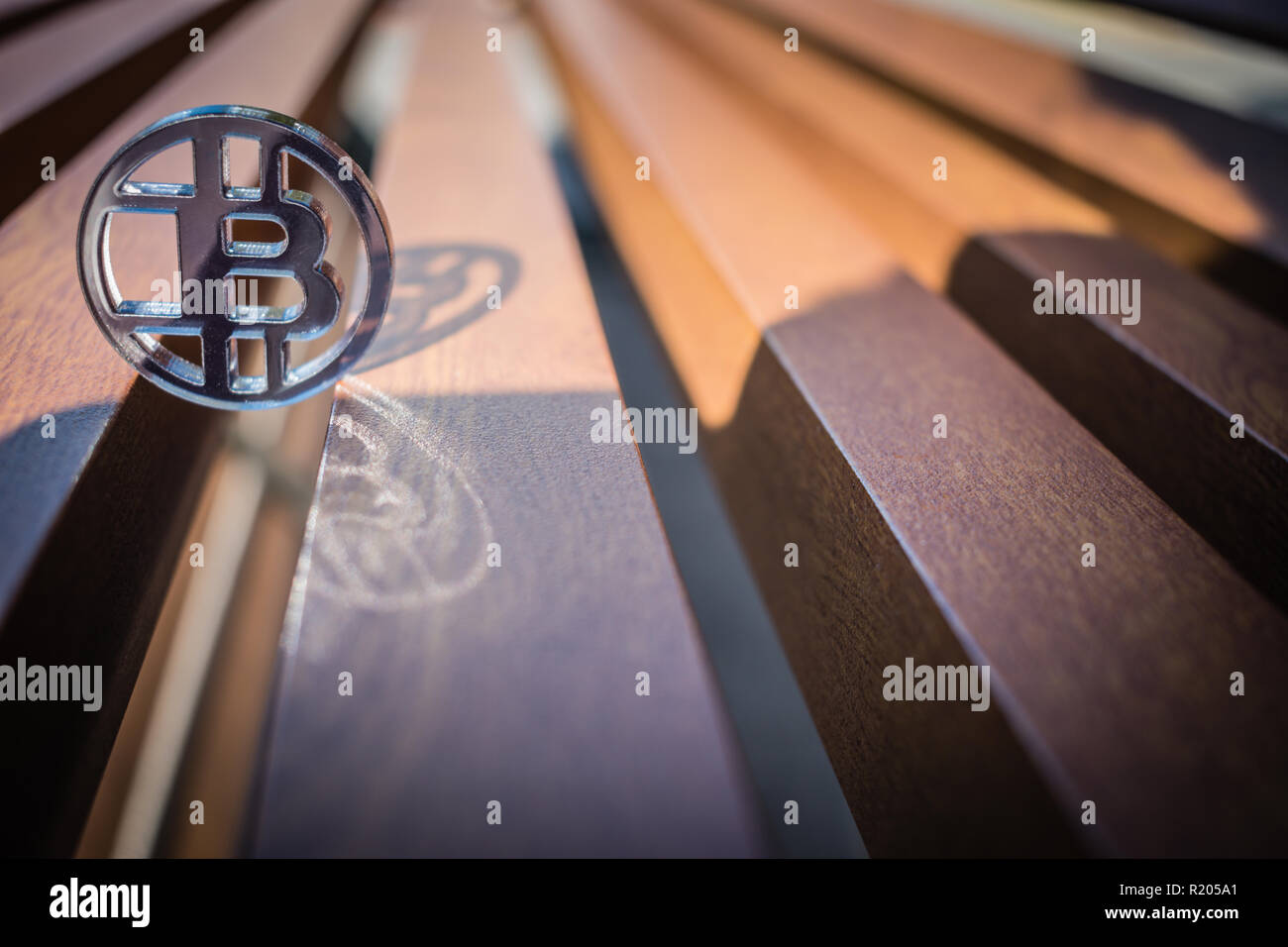Plastic see thru bit coin on wooden background and lines Stock Photo ...