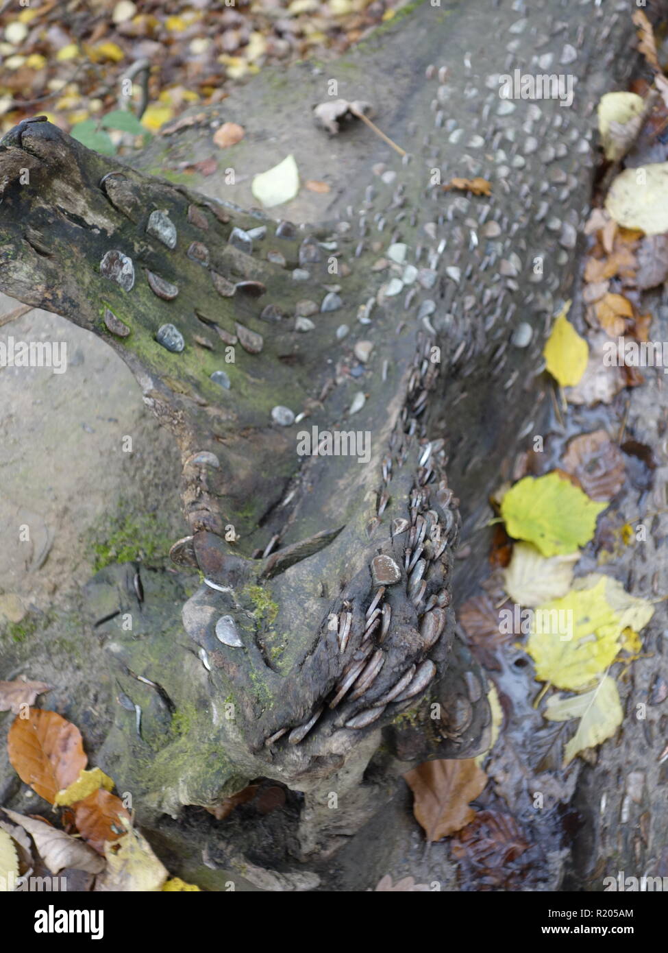 a british penny tree where pennies are hammered into a log for good ...