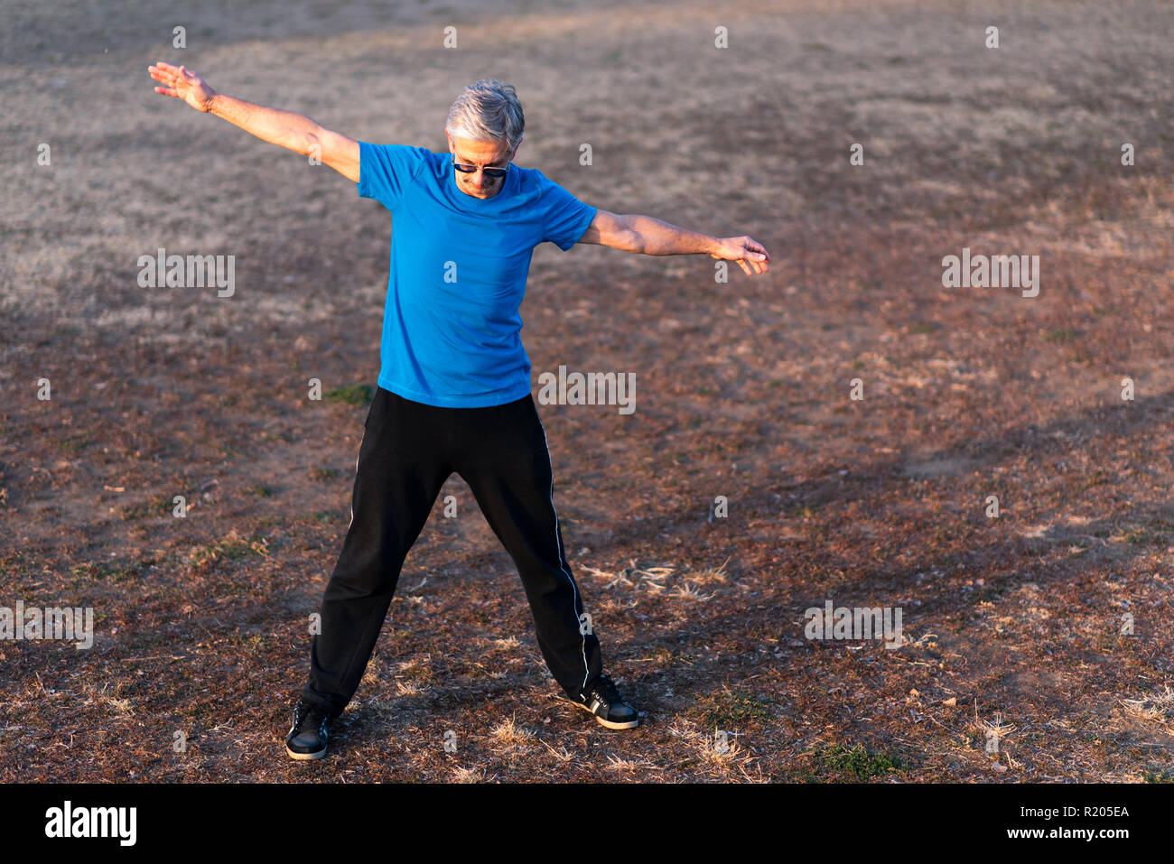 Strong sportsman stretching outside hi-res stock photography and images ...