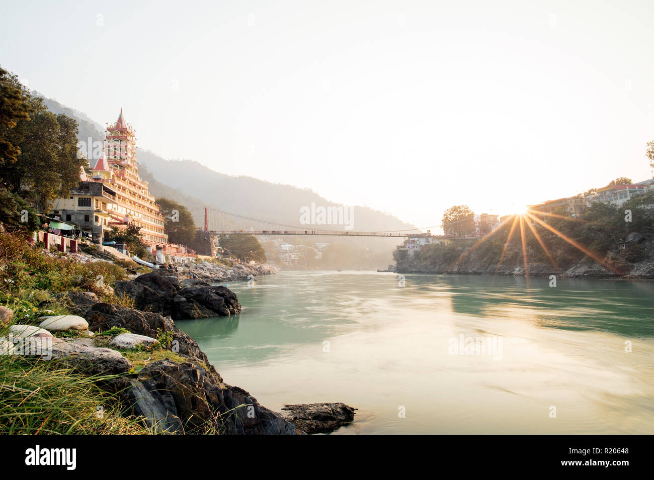 Spectacular view of the Lakshman Jhula bridge and the beautiful Temple ...