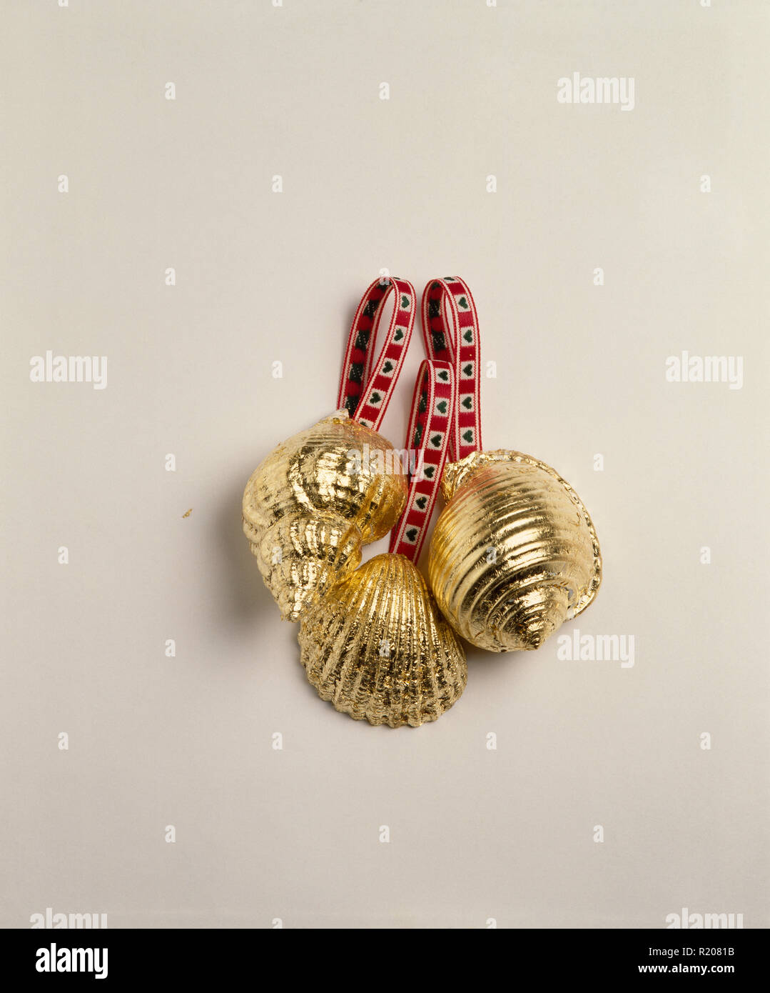 Gold painted seashell Christmas decorations Stock Photo - Alamy