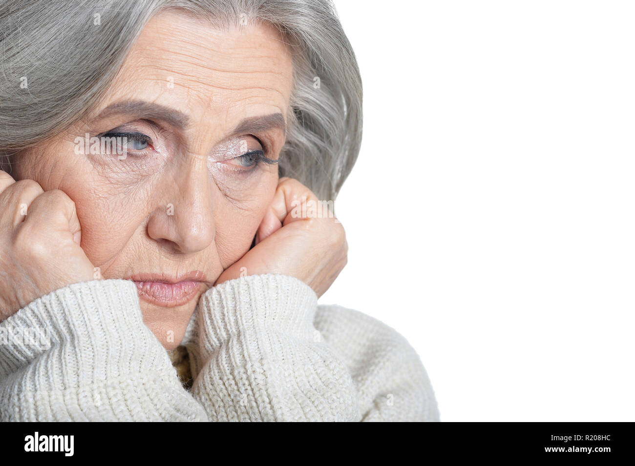 Sad senior woman isolated on white background Stock Photo - Alamy