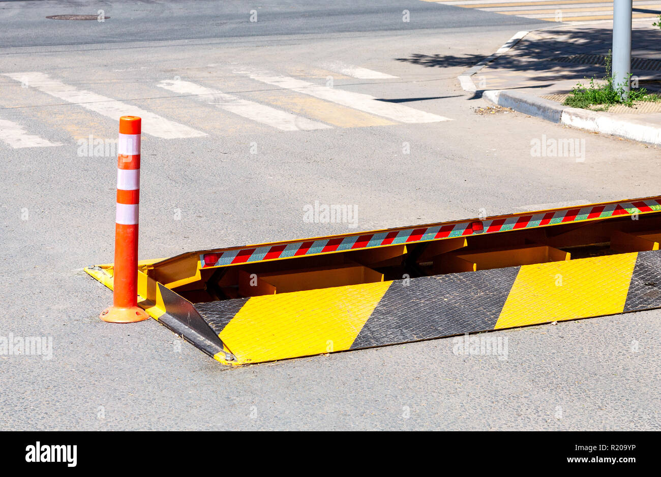 Road barrier with yellow and black striped caution pattern, road fence ...