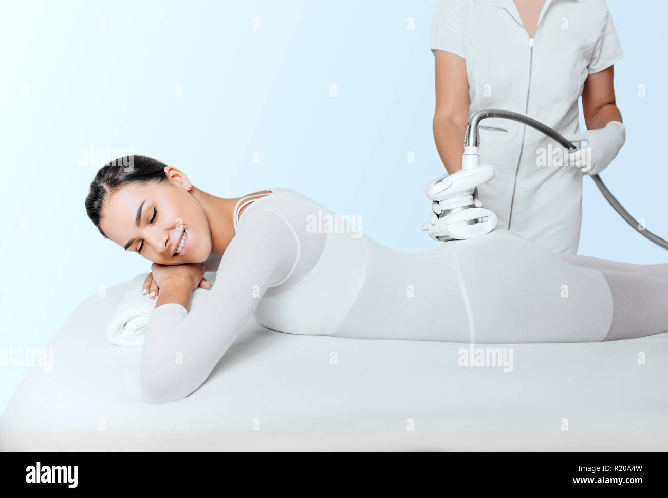 Beautiful woman receiving lpg massage against cellulite Stock Photo - Alamy