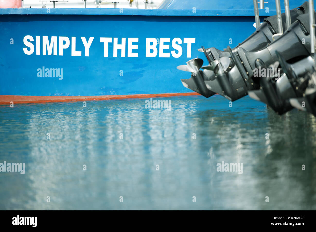 Simply The Best name of boat written on the hull of vessel reflecting ...