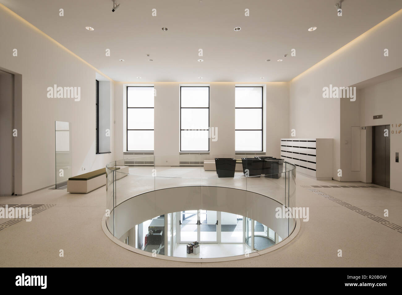 First floor breakout area next to circular foyer void. House of ...